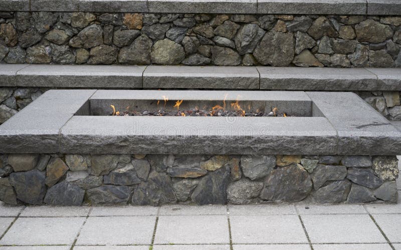 Stone fire pit stock image. Image of flame, fire, relaxing - 73791061