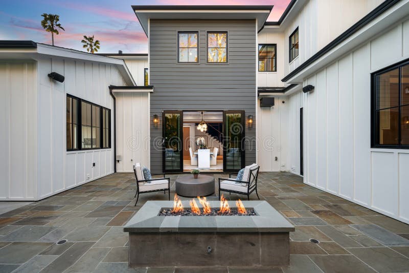 A Stone Fire Pit is on the Patio of a Home Stock Photo - Image of ...
