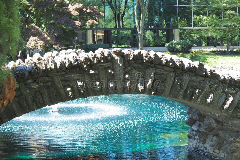 The Stone Footbridge is Above the Pond. Stock Image - Image of lake ...