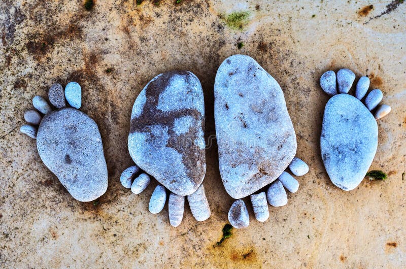 Stone footprints stock image. Image of green, coast, barefoot - 34783235