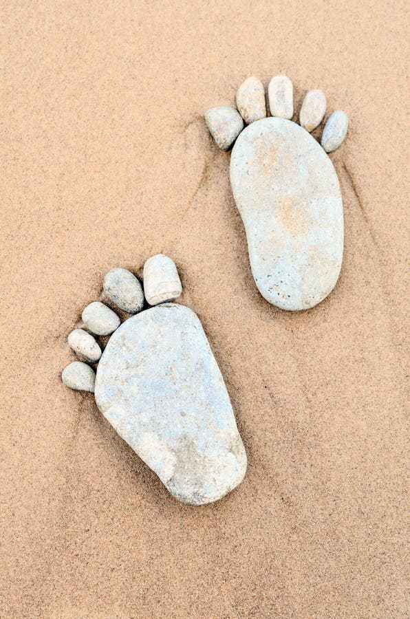 Stone footprints stock image. Image of green, coast, barefoot - 34783235