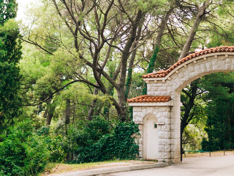 Stone Gate with a Tiled Roof in the Forest. Handmade Stock Photo ...