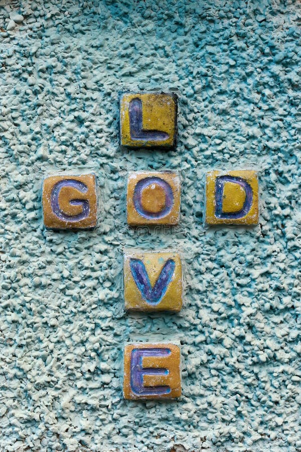 Stone Graved Text Crossing of GOD LOVE on Rough Texture Wall, Vertical ...