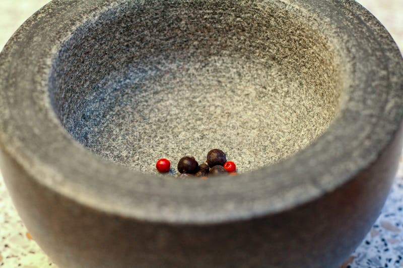 Stone Grinder Bowl. Woman Hands Grinding Pepper in Stone Mortar. Stock ...