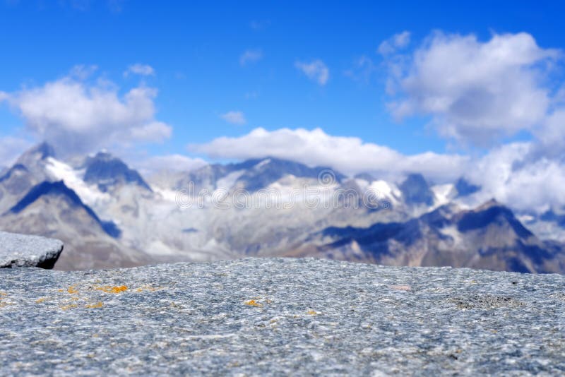 Stone Ground with Blurred Snow Mountain at Gornergrat Cable Station ...