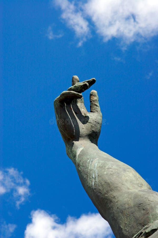 Stone hand in a blue sky stock image. Image of landscape - 747209