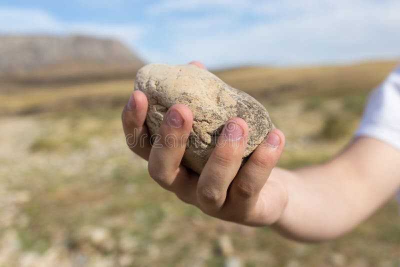 Stone in hand on nature stock image. Image of therapy - 106391751