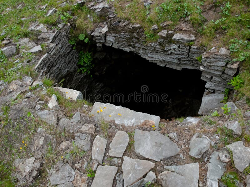 Stone hole of the cave stock image. Image of forest - 295203697