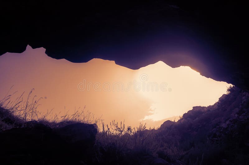 Exterior of a Cave with an Orange Sky Stock Photo - Image of vacation ...