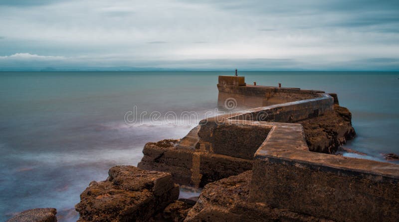 Stone Jetty at the Shore on the Cloudy Day Stock Image - Image of stone ...