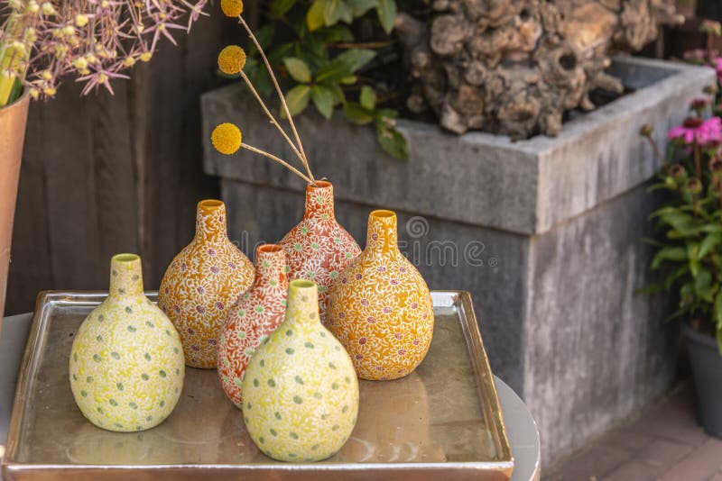 Stone Jugs with a Motif Standing on a Golden Tray Stock Image - Image ...