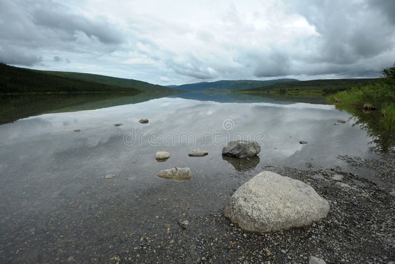 Stone in lake stock image. Image of lake, reflection - 20691185