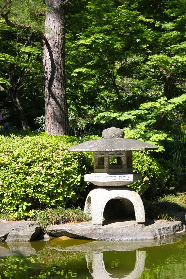 Stone Lantern in the Japanese Garden Stock Image - Image of pond, trees ...
