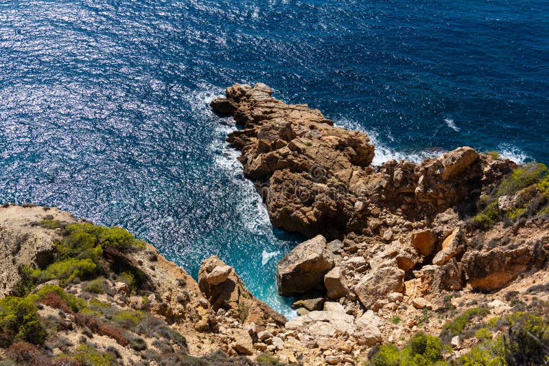 Stone ledge in the sea stock image. Image of coastline - 336904553
