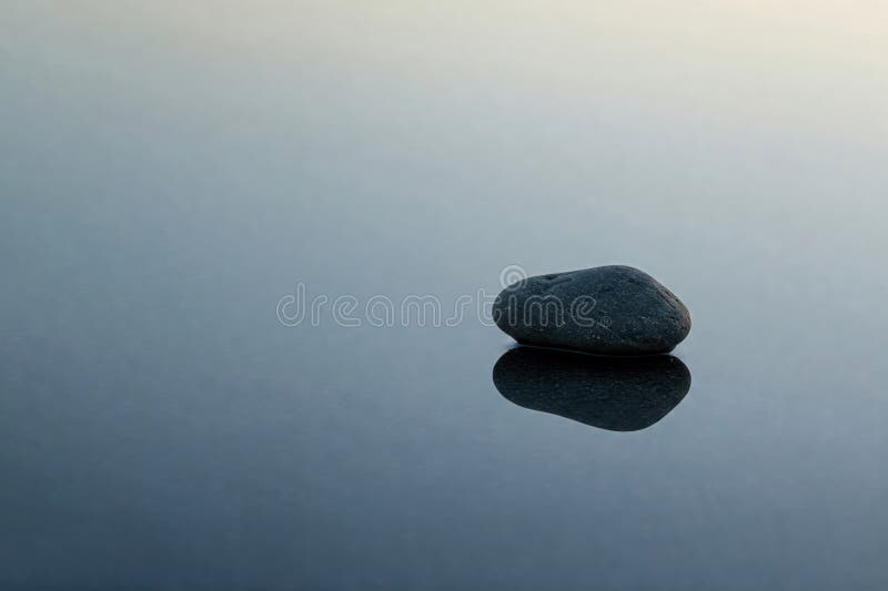 Stone Lying on the Surface of Water with Reflection. Space for Text ...