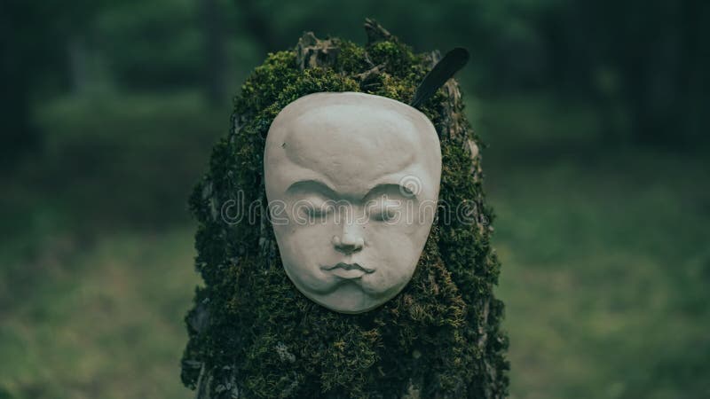 Stone Mask on a Tree Trunk. Stock Photo - Image of tree, mask: 272866348