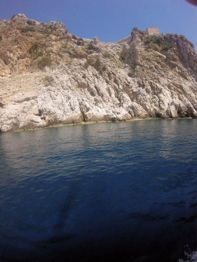 Stone Mountain, Slope, Cliff Over Water, Sea, Ocean Stock Photo - Image ...