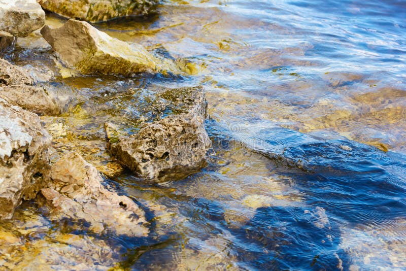 Stone Near the River. Waves Run on the Coastline. Summer Sunset Stock ...