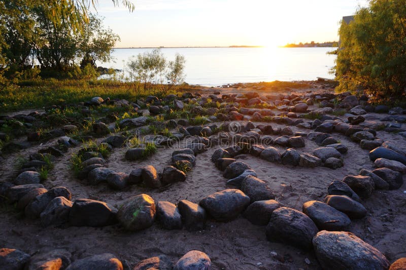 Stone maze by the river... stock image. Image of tree - 289787433