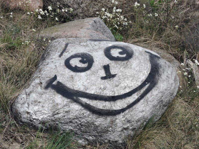 Stone with Painted Happy Face Stock Image - Image of painted, texture ...