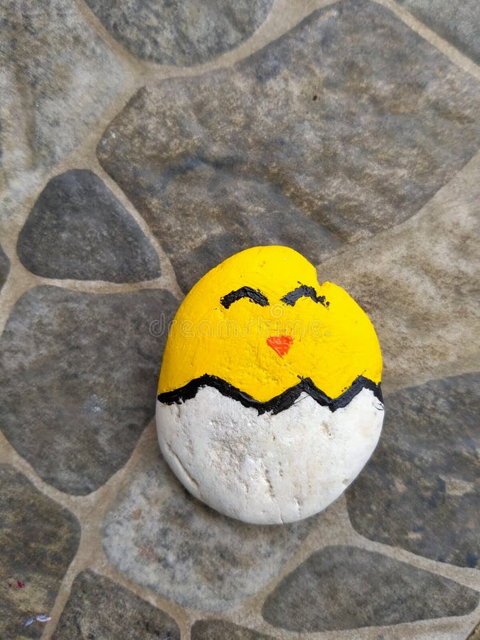 A Stone Painted Like a Chicken that Just Hatched from an Egg Stock ...