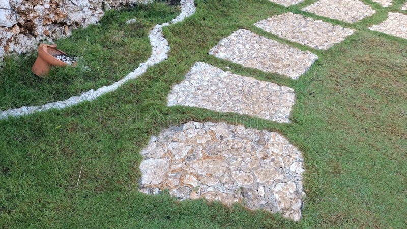 A Stone Path with a Pot on the Grass Stock Photo - Image of footpath ...