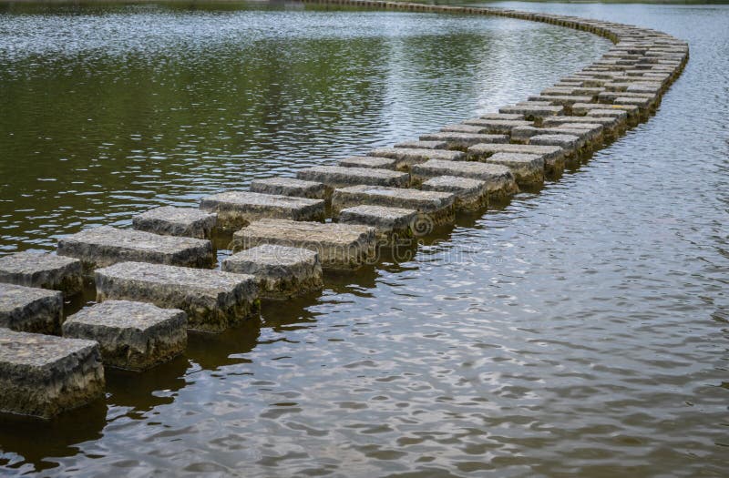Stone path throw lake stock image. Image of peaceful - 74008365