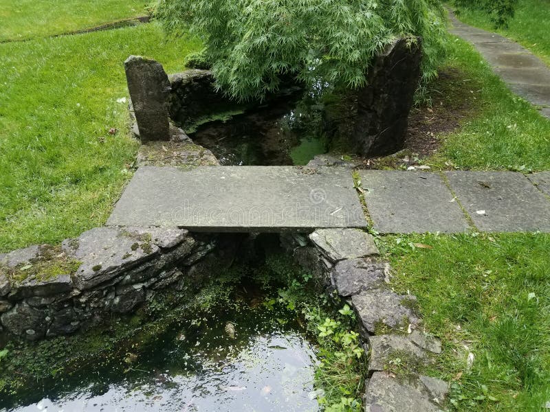 Stone Path and Tiles and Bridge Over Water Stock Image - Image of water ...