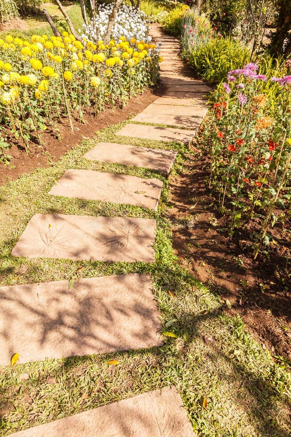 Stone Path Winding in Fresh Spring Flower Garden Stock Photo - Image of ...