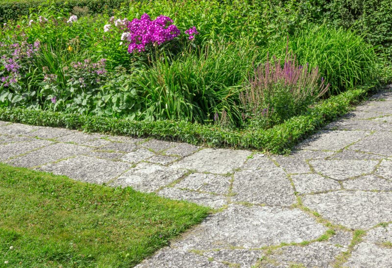 Stone Paths in a Flowering Garden Stock Photo - Image of color, garden ...