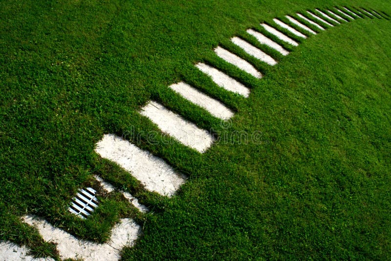 Stone Pathway Across Cultivated Lawn and Drain Grid Stock Image - Image ...