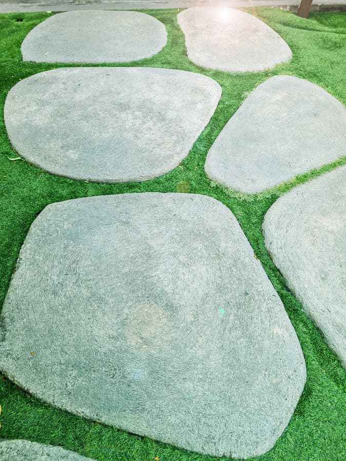 Stone Pathway on Bright Green Grass Stock Photo - Image of outdoor ...
