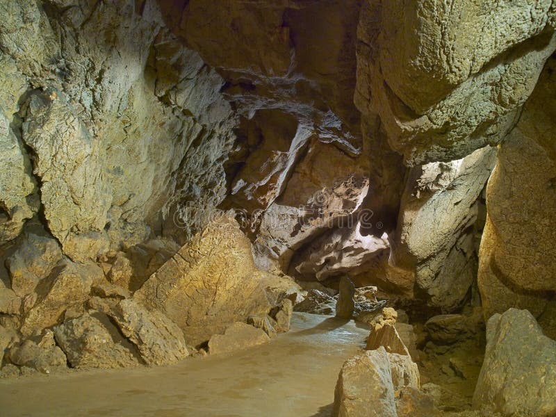 Stone Cavern in Green Steppe Landscape View with Cloudy Sky and Steppe ...