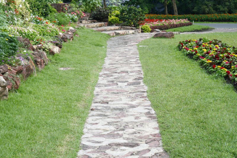 Stone pathway into garden stock image. Image of path - 47619773