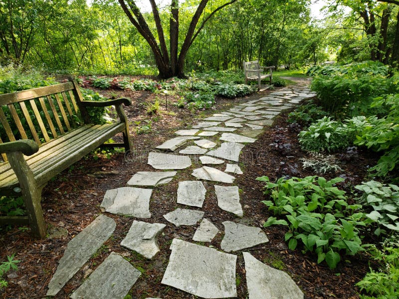 Stone pathway in a garden stock image. Image of garden - 151069137