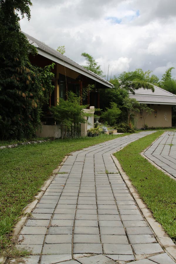 Brick Pathway in the Hotel Resort Stock Image - Image of grass, road ...