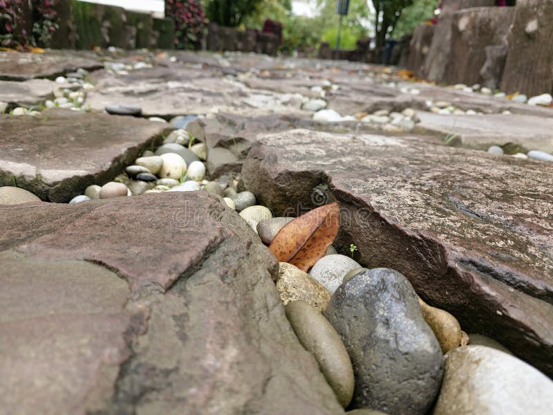Stone Pathway Lined with Small Rocks and Gravel Stock Photo - Image of ...