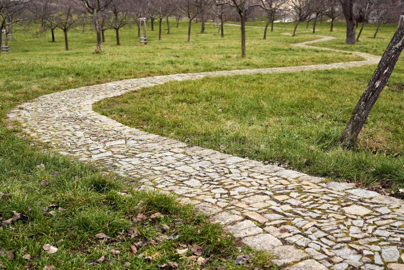 Stone pathway in a park stock photo. Image of green - 206610120