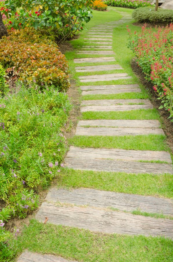 Overgrown Weathered Wooden Bench,paved Garden Path Stock Photo - Image ...