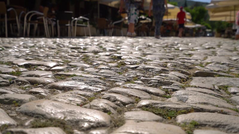 Ground Level Shot of Group of People Moving on Ice Covered Surface of ...