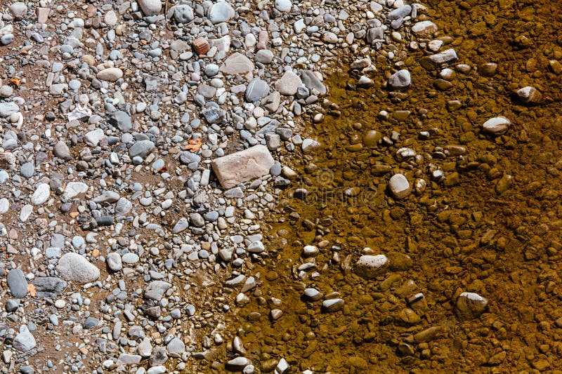Stone Pebbles on the Shore As an Abstract Background. Texture. Stock ...