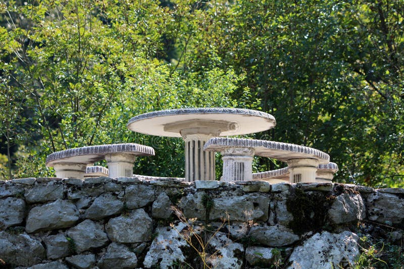 Stone Picnic Table and Curved Benches Viewed from Below on Rock ...