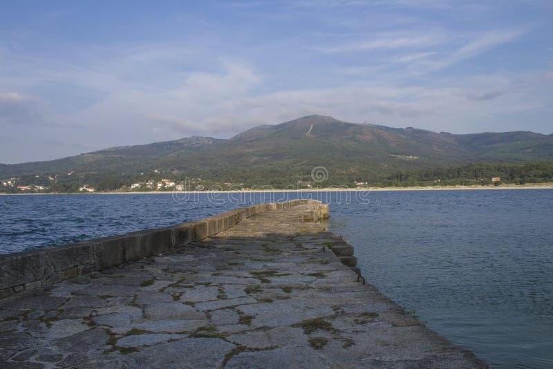 Stone pier towards the sea stock image. Image of pier - 153882531