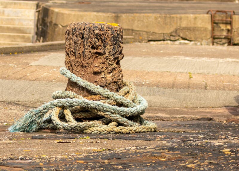 Stone Pillar with Old Rope in the Harbor in Pennan Stock Photo - Image ...