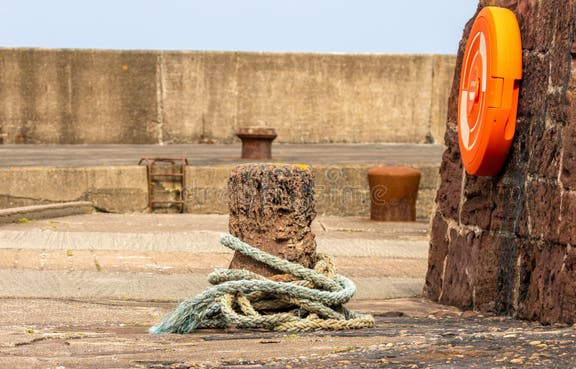 Stone Pillar with Old Rope in the Harbor in Pennan Stock Photo - Image ...