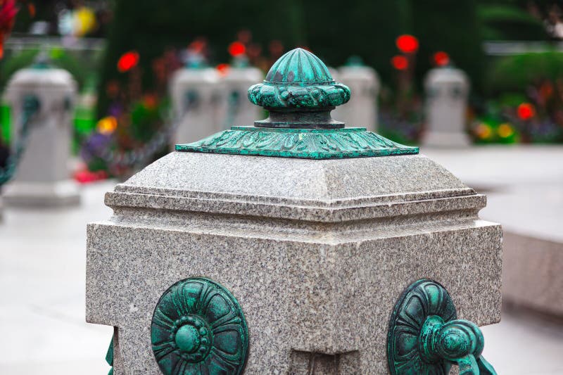 Stone Post with a Metal Carved Top Stock Image - Image of garden, green ...