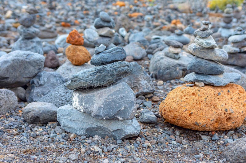 Stone pyramid on a beach stock photo. Image of detail - 313724116