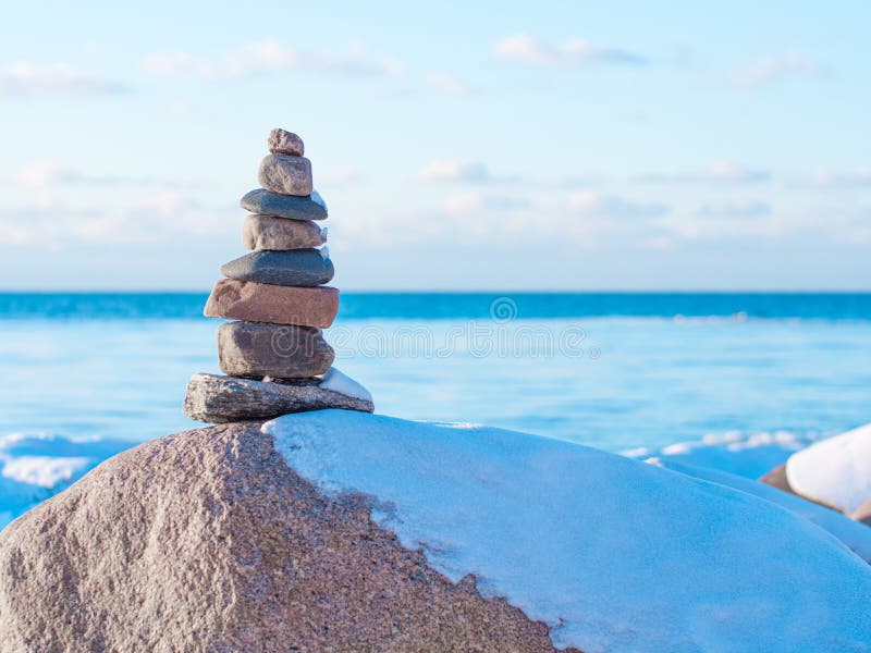 A Stone Pyramid on a Rock, Snow on the Rocks Stock Photo - Image of ...