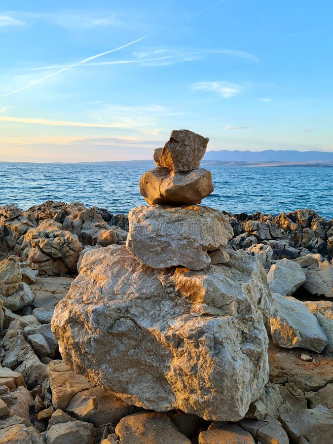 Stone Pyramid on the Seashore with Beautiful Cloudy Sky in the ...