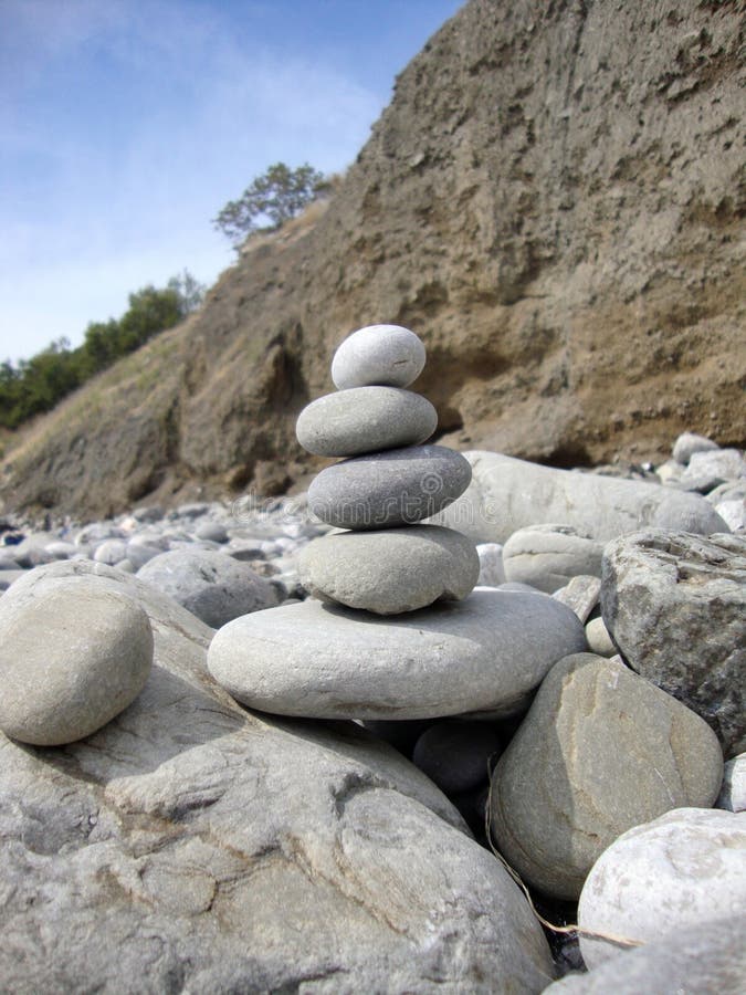 Stone pyramid on seashore stock image. Image of chill - 120212941